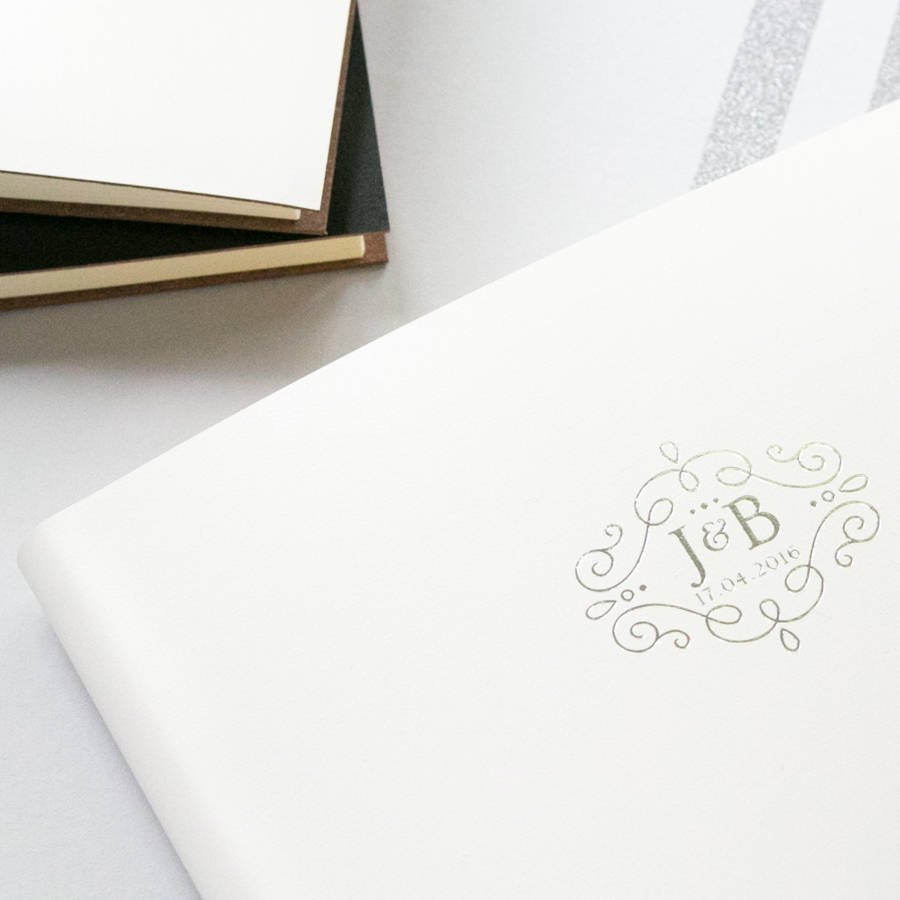 wedding guest book with a wedding logo designed by begolden ...