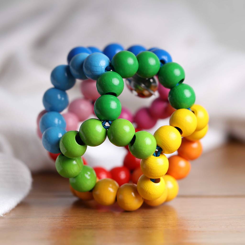 wooden baby bead ball rattle by nest | notonthehighstreet.com