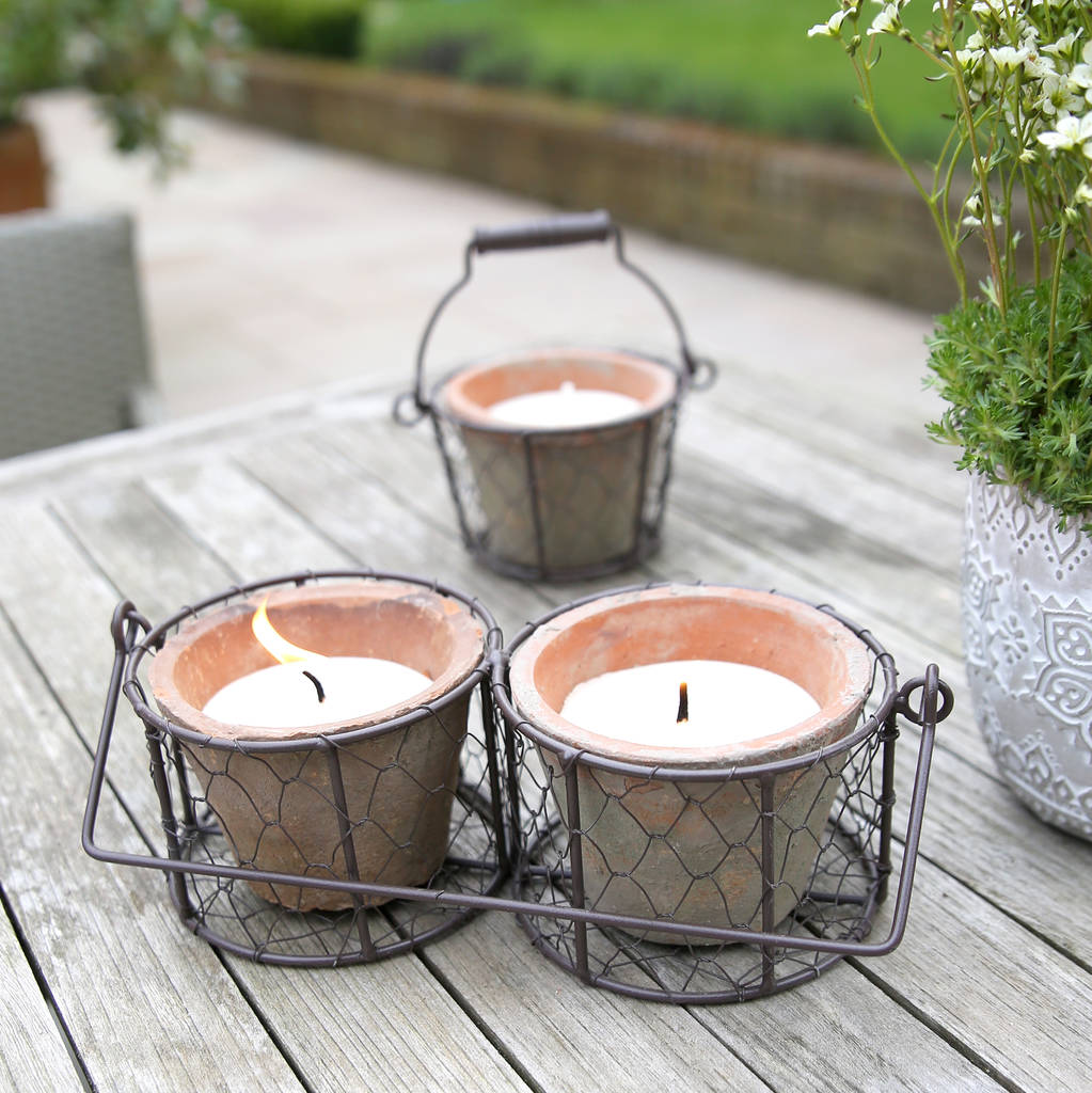 Citronella Candle Pots In Metal Carrier By Red Lilly Notonthehighstreet citronella-candle-pots-in-metal-carrier-by-red-lilly-notonthehighstreet