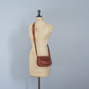 curved brown leather saddle bag by paper high | notonthehighstreet.com