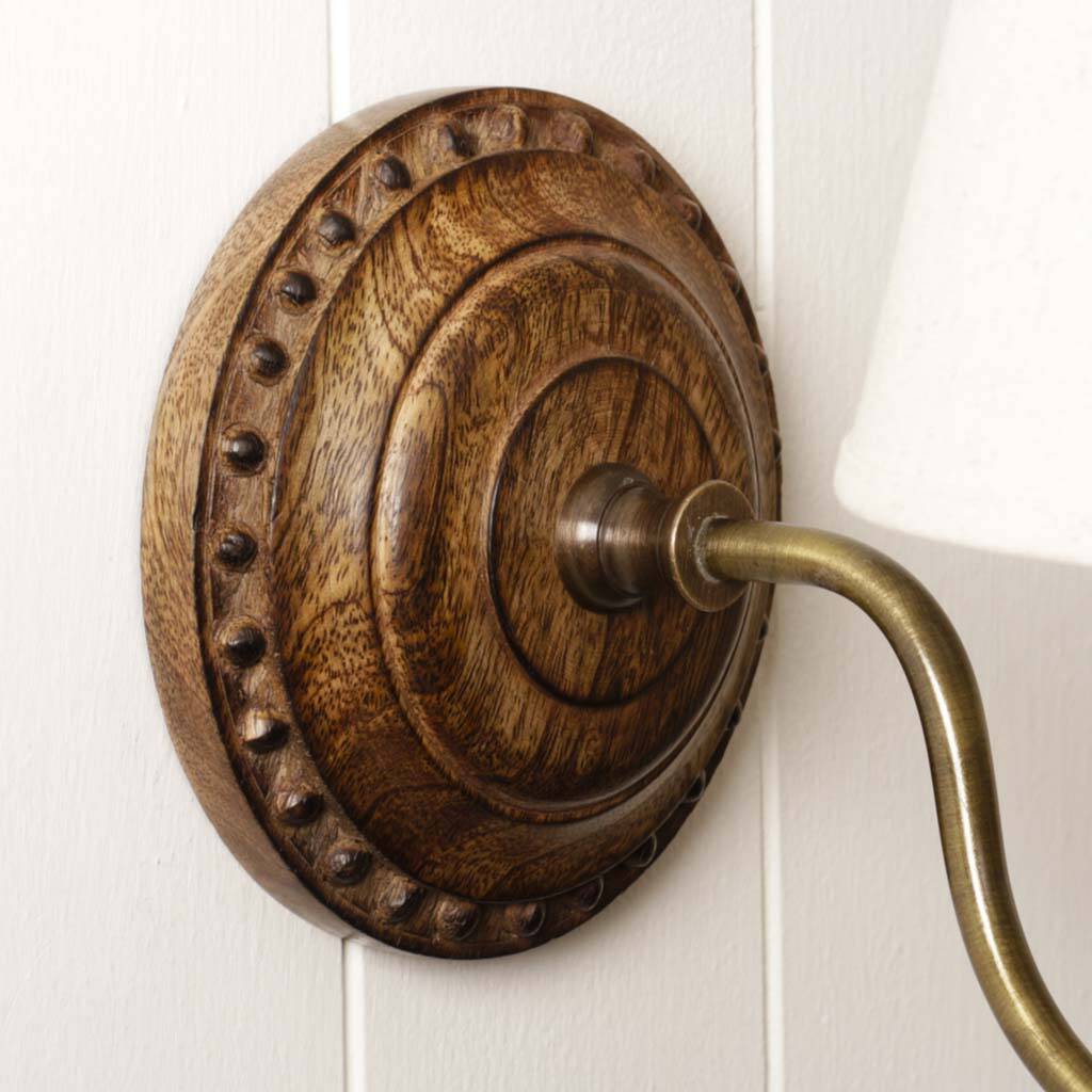 carved wooden wall light with linen shade by dibor | notonthehighstreet.com