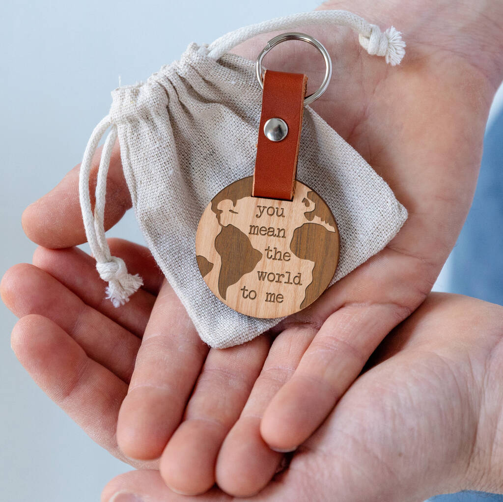engraved 'you mean the world to me' wood globe keyring by dust and ...