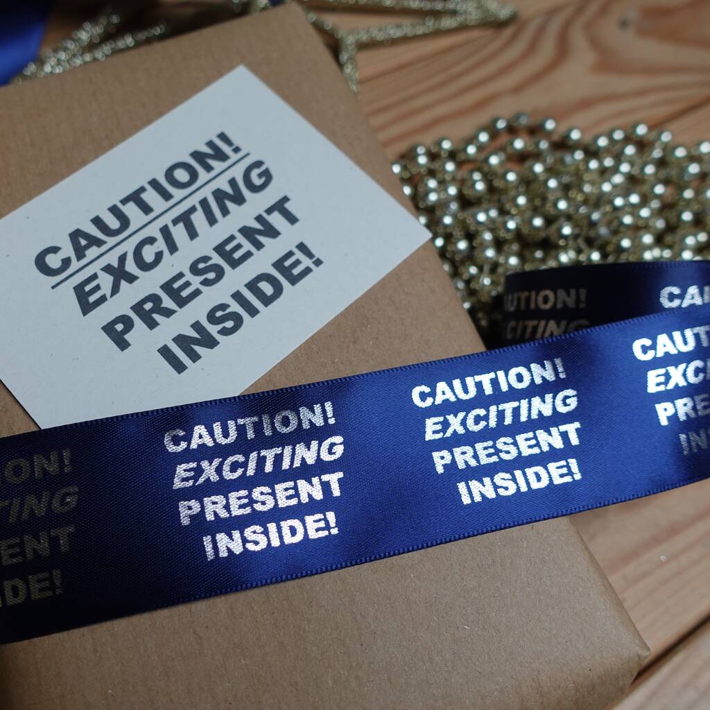 Purple 'Exciting Present!' Joke Ribbon By Yellow Green Blue ...