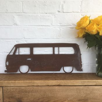 rusted metal camper van sign by the rustic warehouse ...
