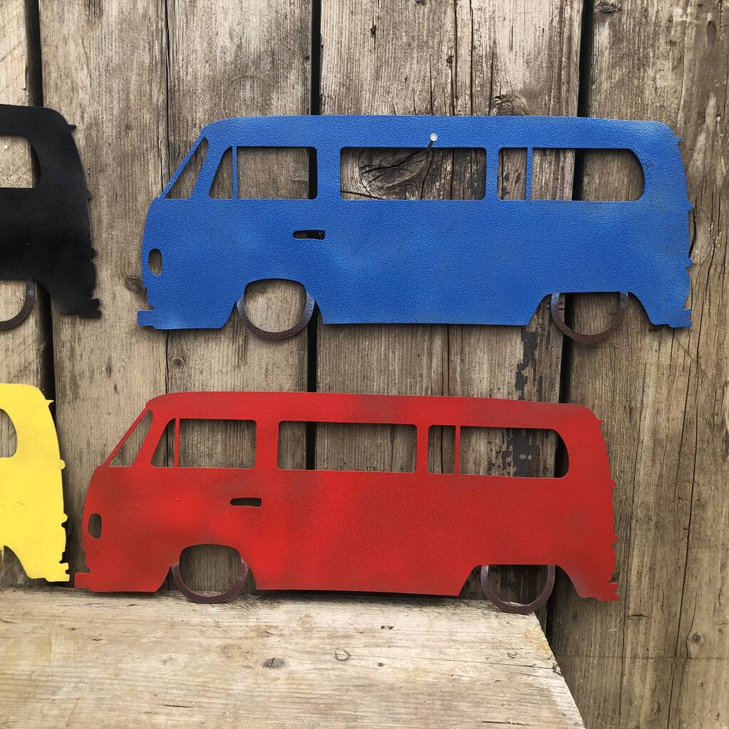 rusted metal camper van sign by the rustic warehouse ...