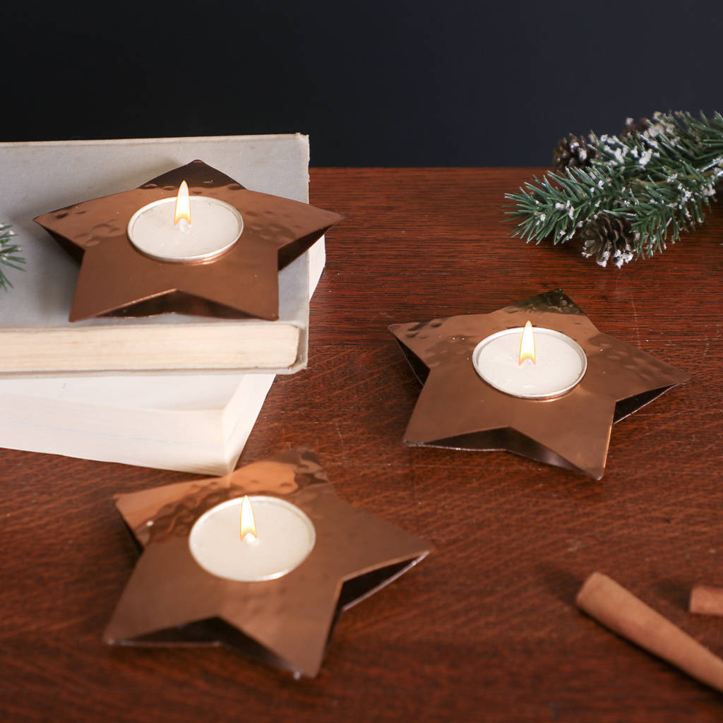 set of three copper shooting star tea light holders by dibor ...