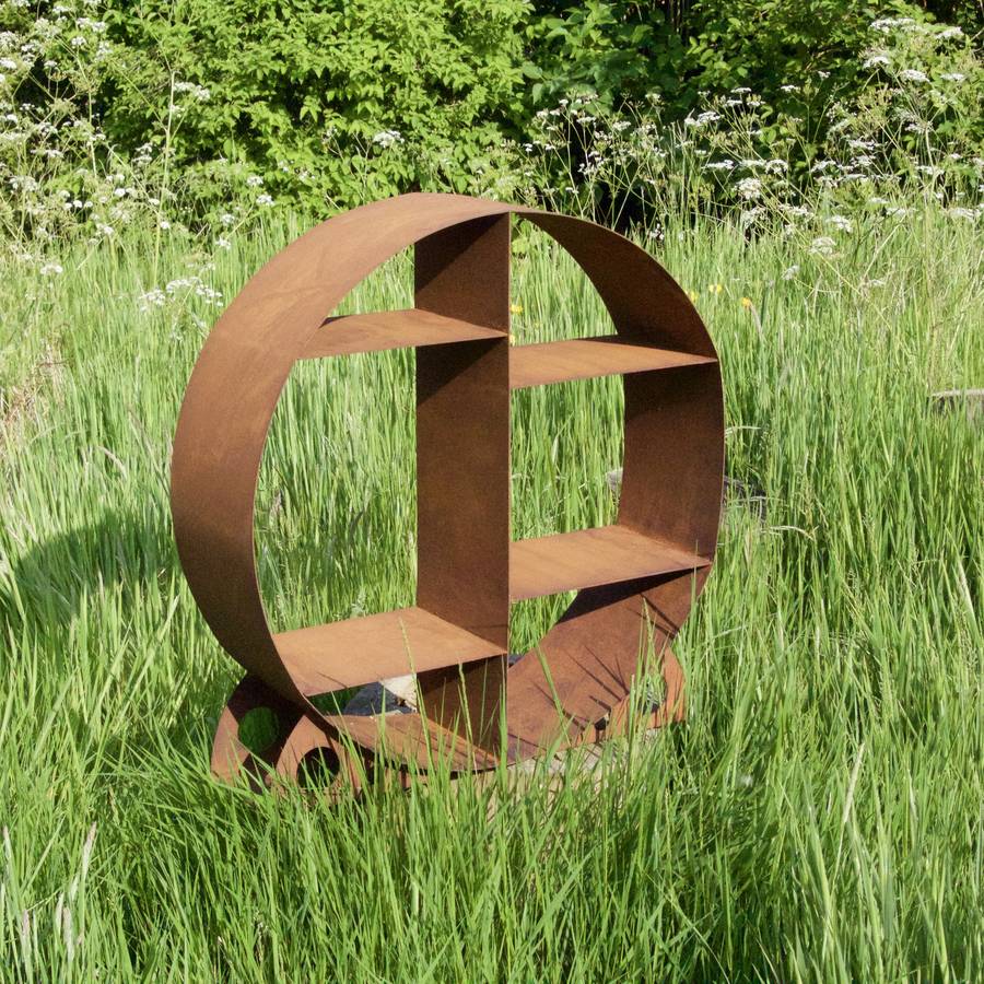 circular metal outdoor log store by ella james | notonthehighstreet.com