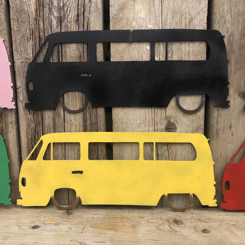 rusted metal camper van sign by the rustic warehouse ...